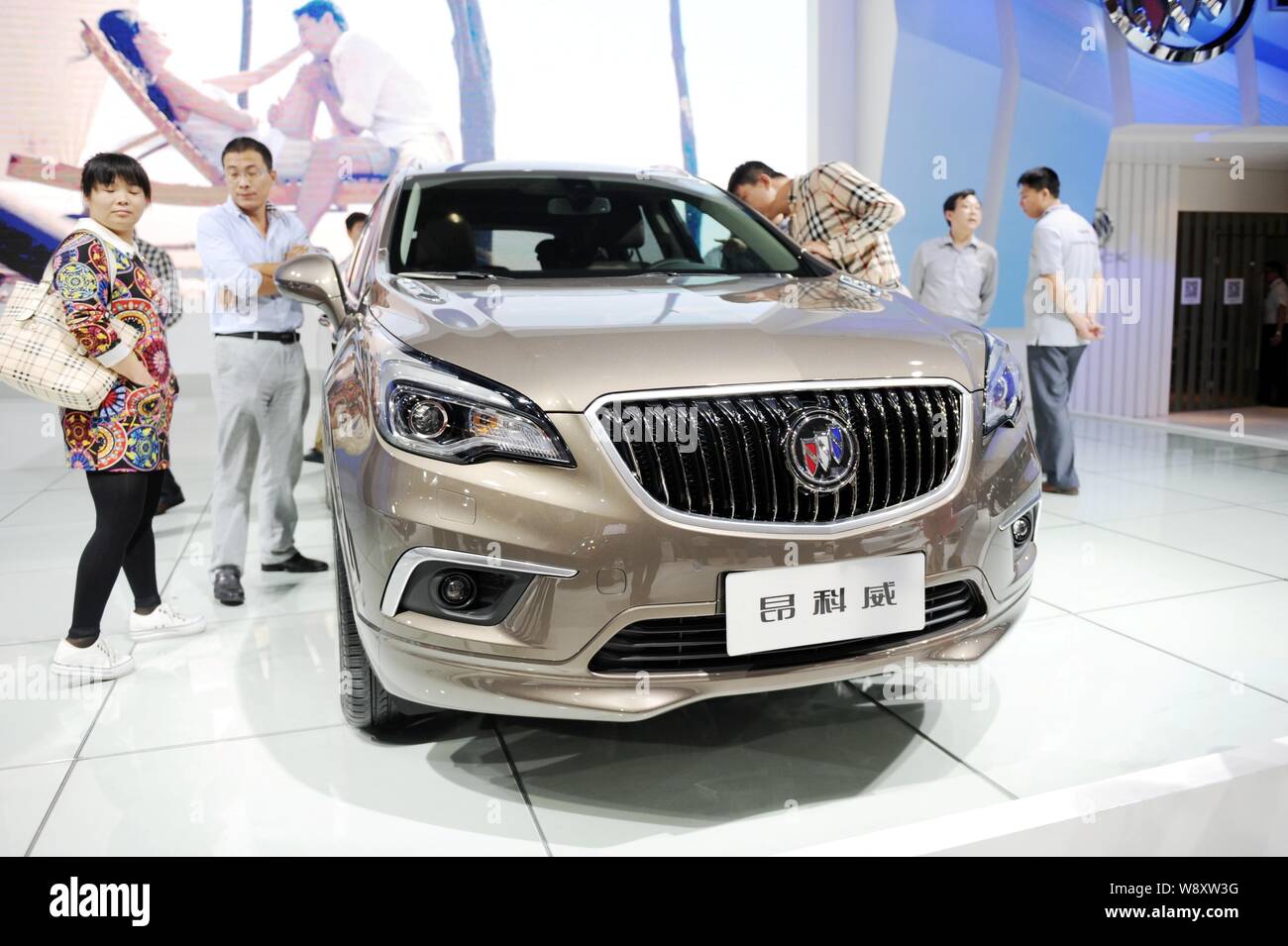--FILE--Visitors view a Buick Envision of Shanghai GM, a joint venture ...