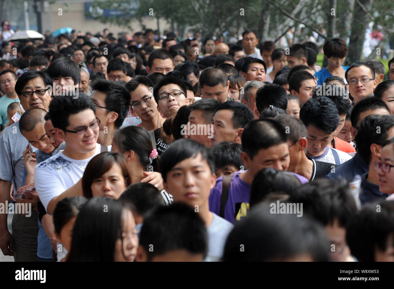 Tourists crowd the Palace Museum, also known as the Forbidden City ...