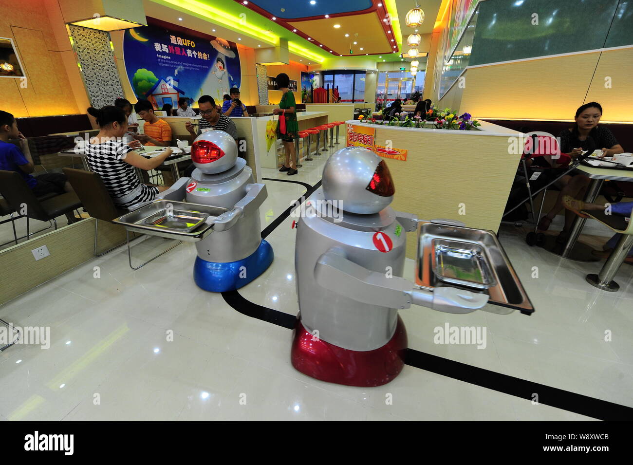 Robots are delivering dishes at a Robot Restaurant in Kunshan city ...