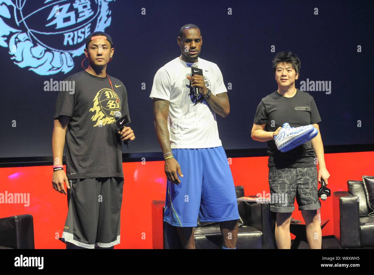NBA superstar LeBron James, center, speaks next to Chinese pianist Lang ...