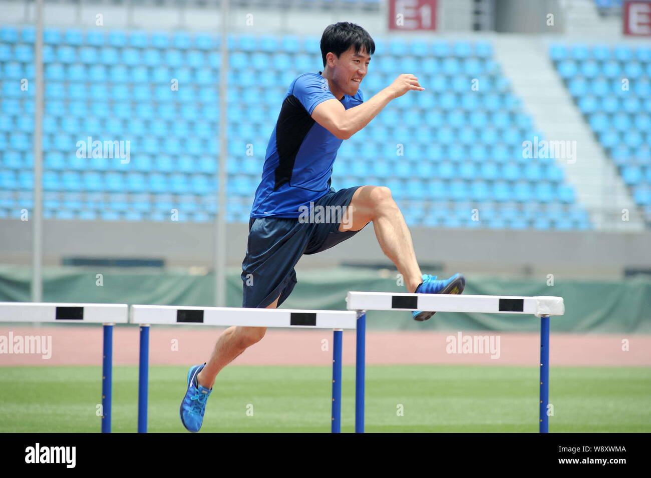 --FILE--Chinese star hurdler Liu Xiang shows his hurdle skills during ...