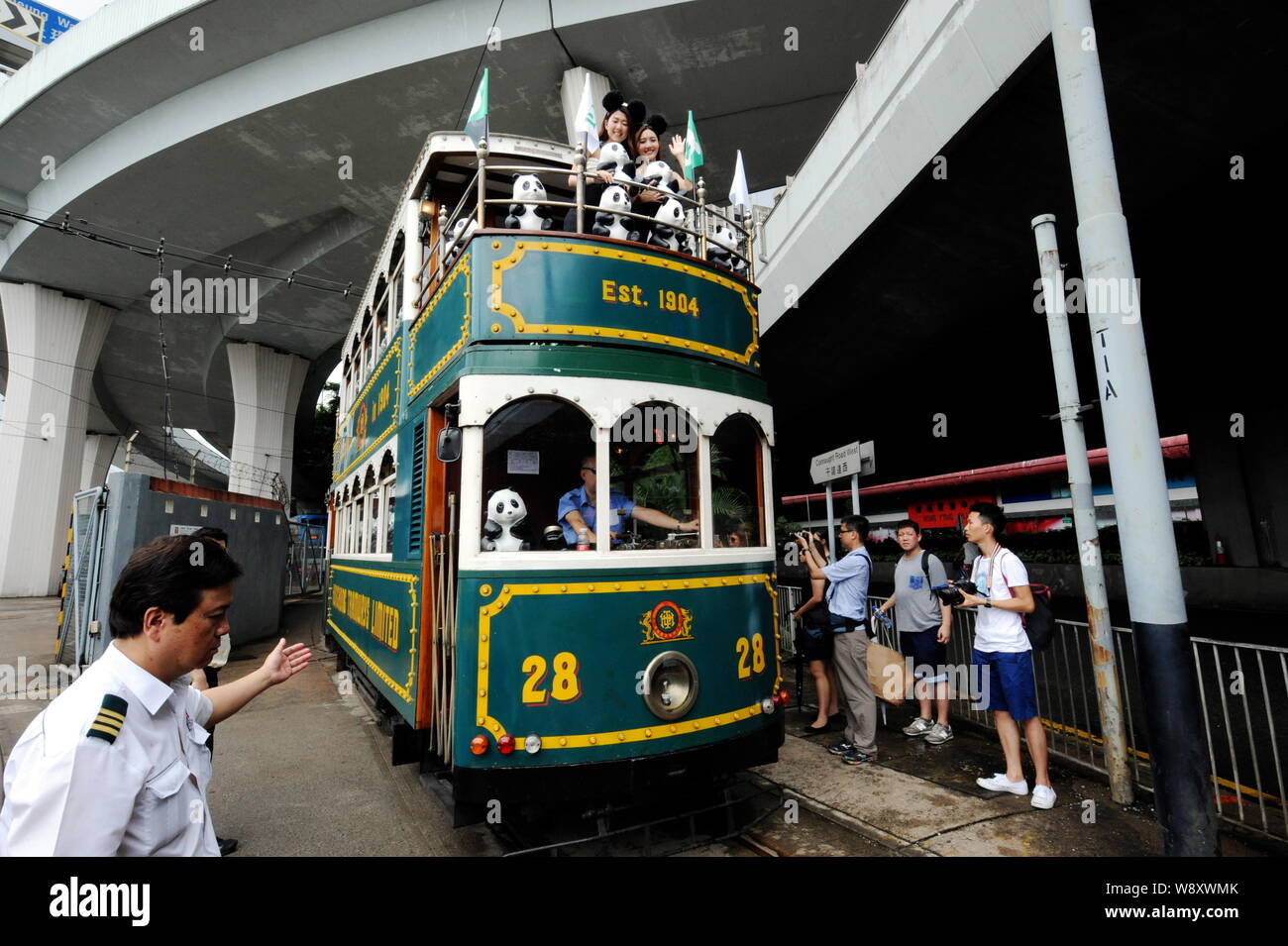 A double-decker tram with the paper pandas created by French artist ...