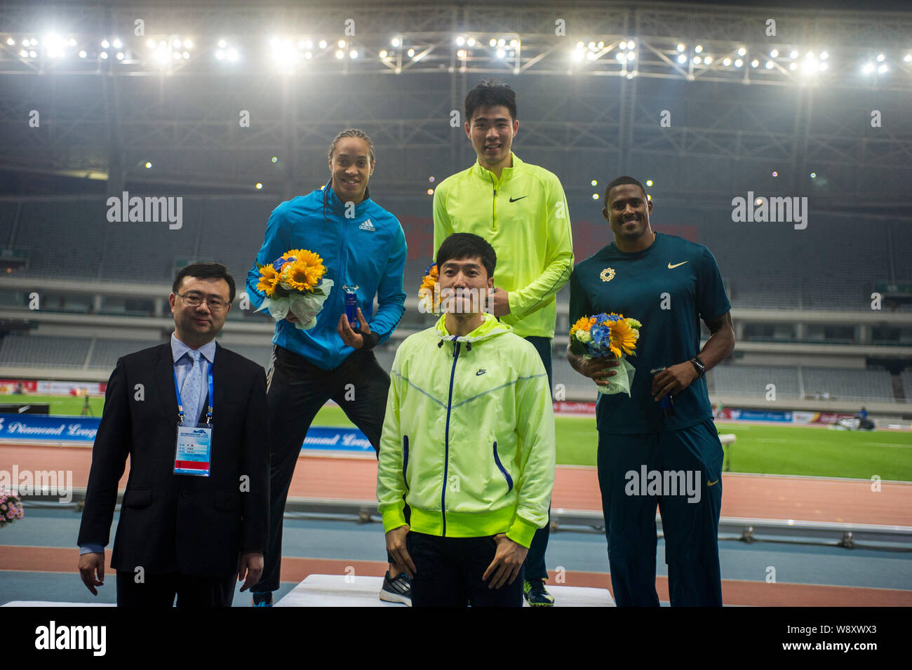Chinese star hurdler Liu Xiang, front right, poses with (back from left ...
