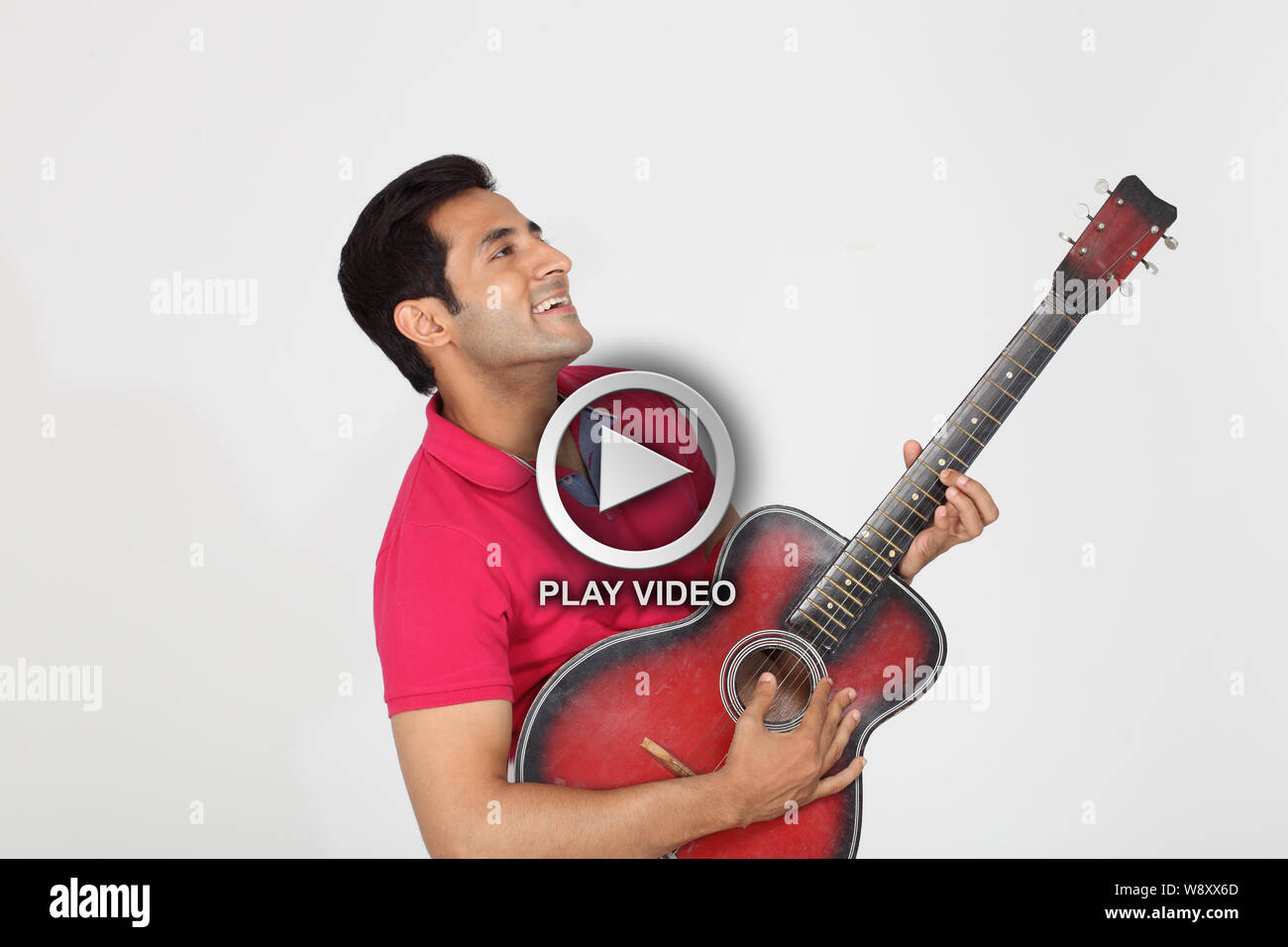 Indian man playing music hi-res stock photography and images - Alamy