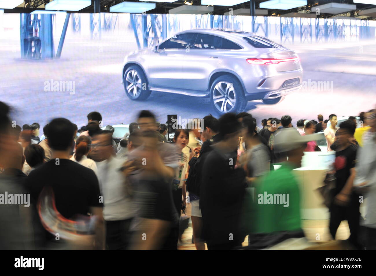 Visitors crowd the stand of Mercedes-Benz during the 13th Beijing ...