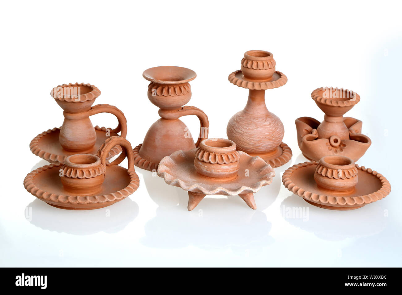 Decorative ceramic products on white background Stock Photo - Alamy