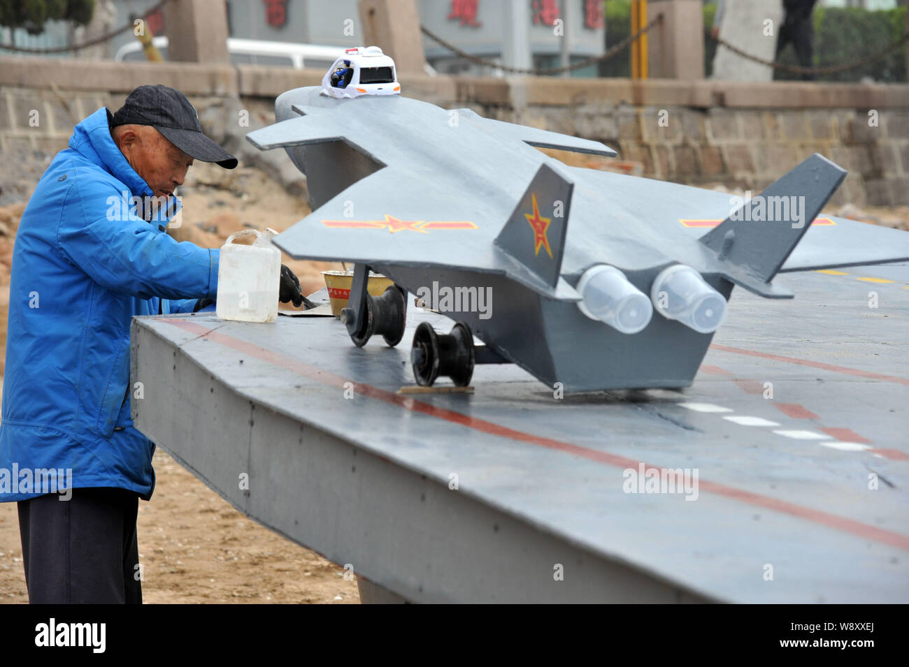 80-year-old Wen Yuzhu repairs his homemade model of Chinas first ...