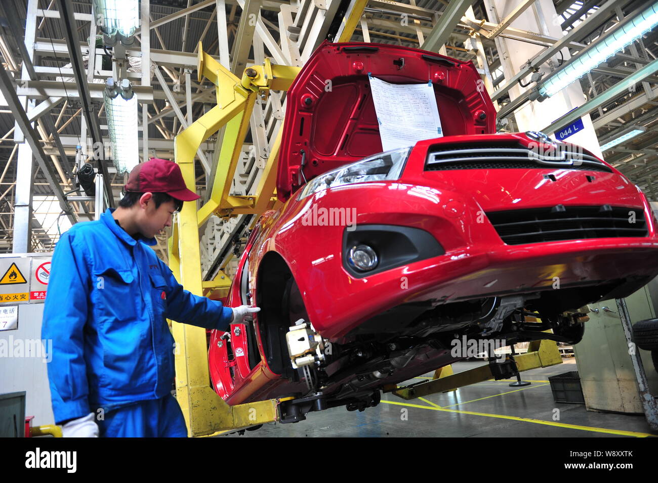 File A Chinese Worker Assembles A Car On An Assembly Line At A Plant Of Brilliance Auto Group