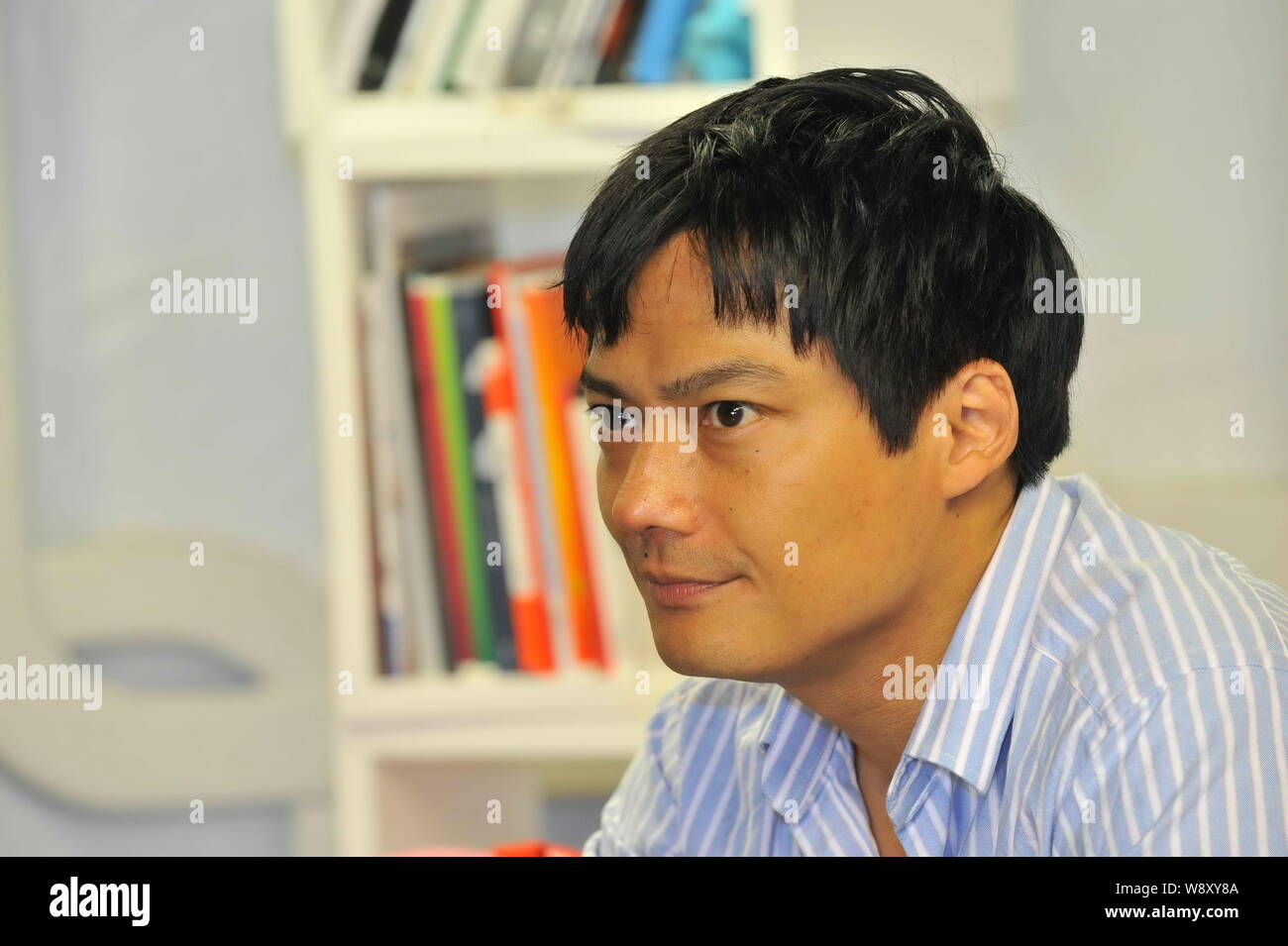 --FILE--American actor Archie David Kao listens during an interview in ...