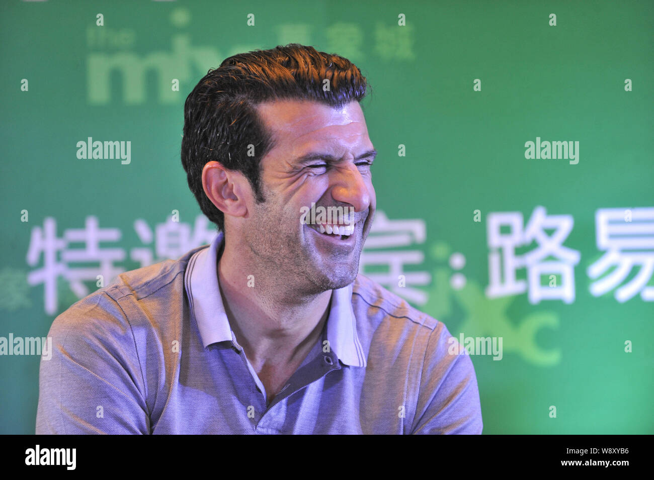 Portuguese football star Luis Figo reacts during a fans meeting at a ...