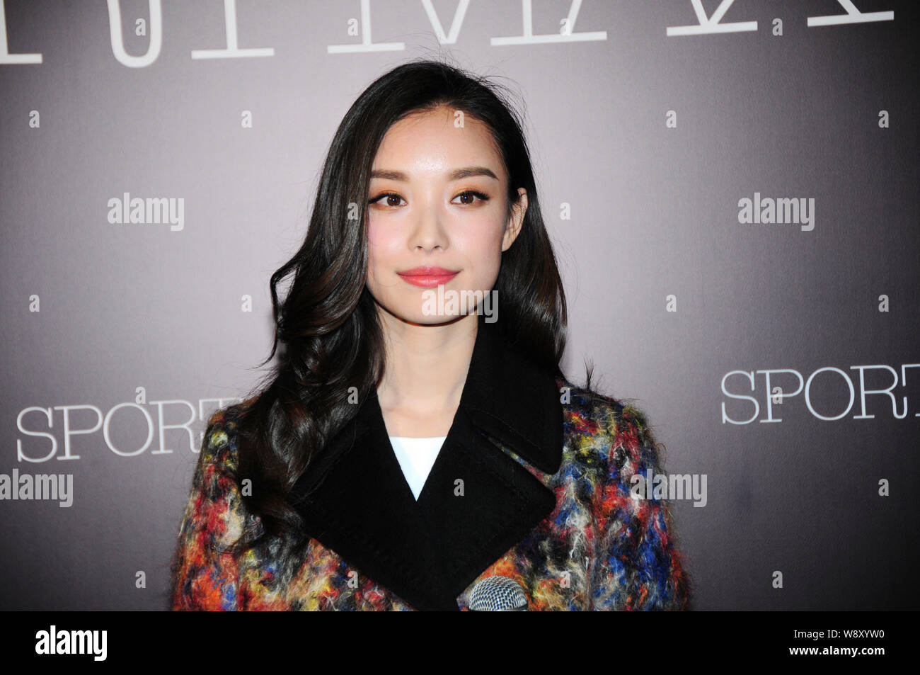 Chinese actress Ni Ni poses as she arrives for a fashion show of ...