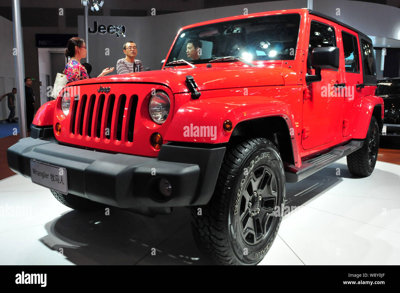 --FILE--Visitors look at a Jeep Wrangler of Chrysler during an auto ...