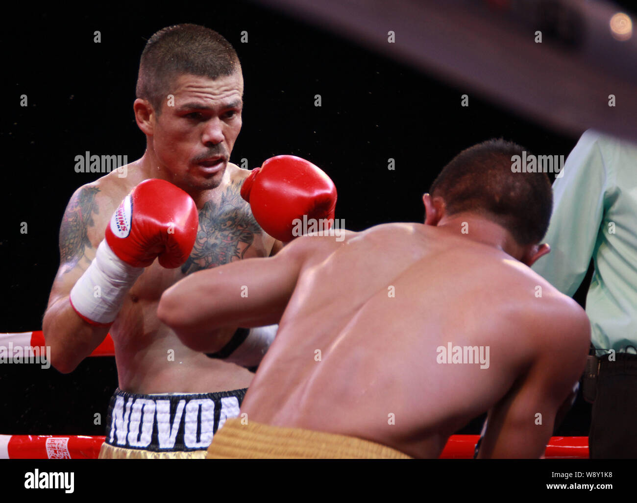 Oswaldo Novoa of Mexico, left, prepares to hit Xiong Chaozhong of China ...