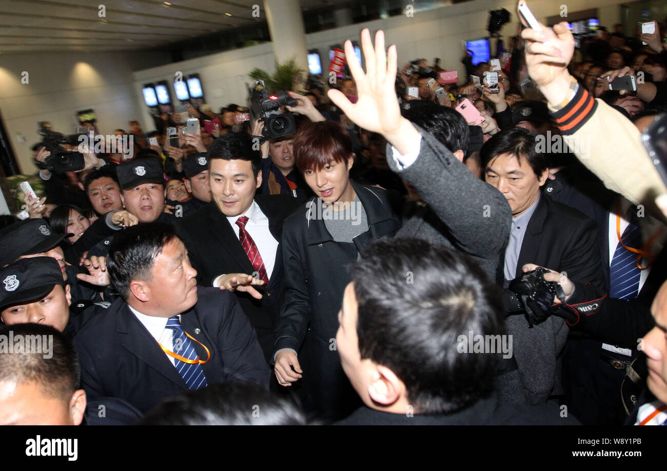 South Korean actor Lee Min-ho, center, is surrounded by crowds of fans ...