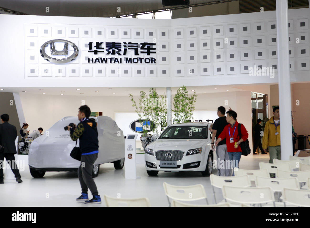 --FILE--People visit the stand of Hawtai Motor during the 13th Beijing ...