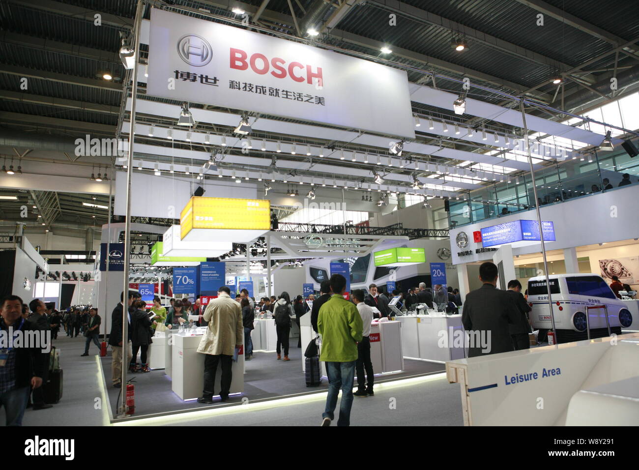 People visit the stand of Bosch during the 13th Beijing International ...