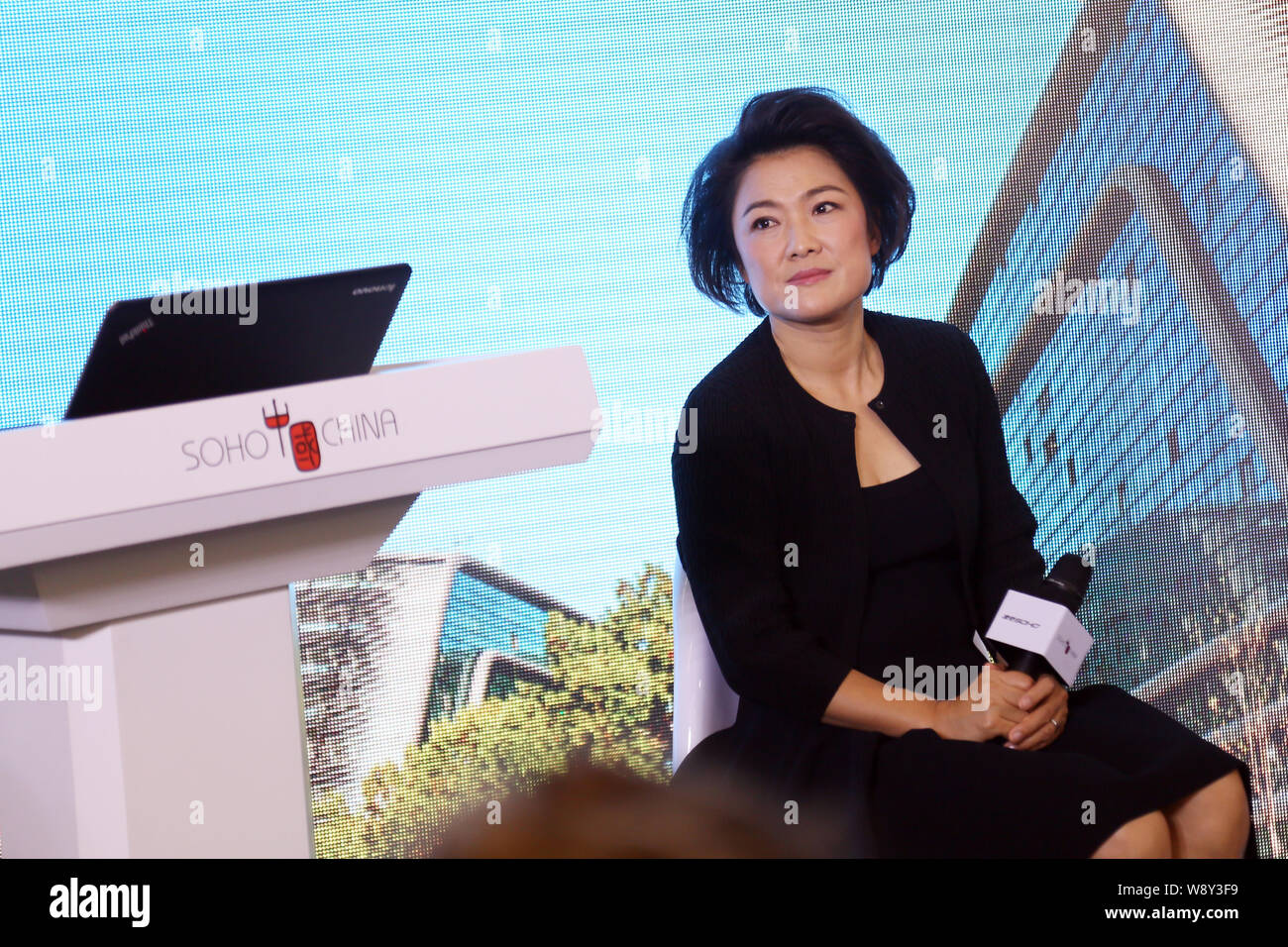 Zhang Xin, left, co-founder and co-CEO of SOHO China, attends the ...