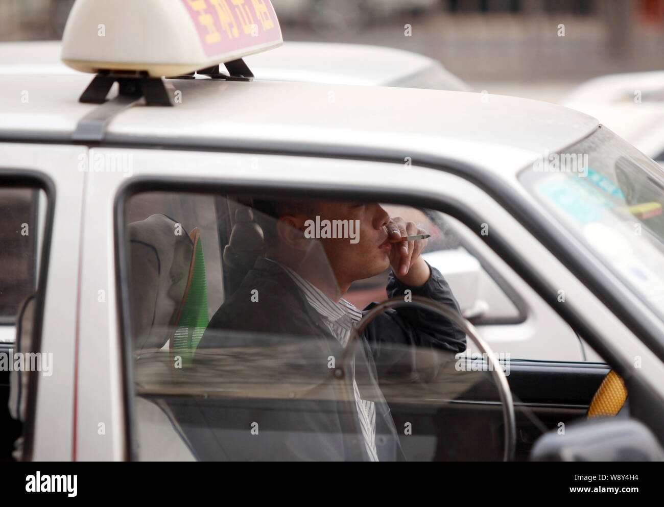 Chinese Taxi Driver High Resolution Stock Photography and Images - Alamy