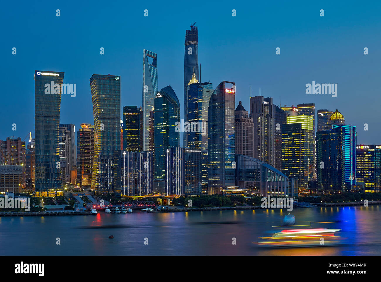 --FILE--Night view of skyscrapers and high-rise buildings with the ...