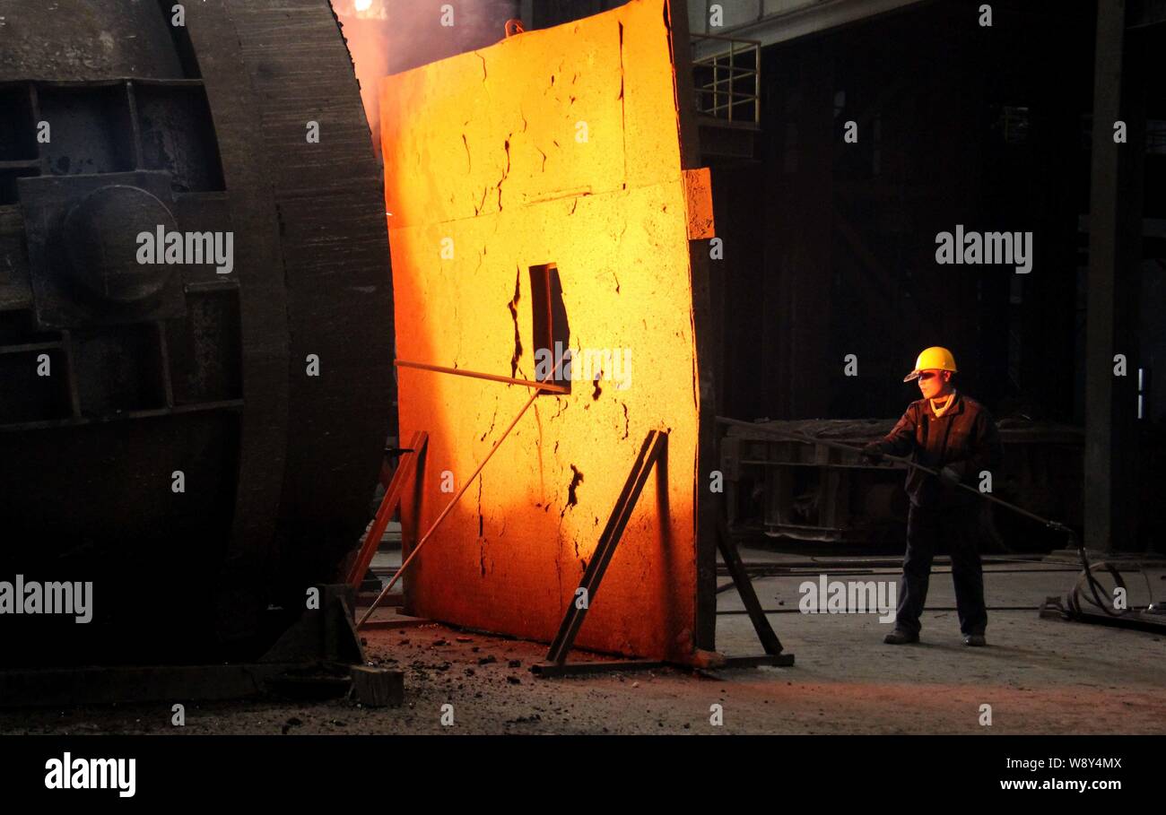--FILE--A Chinese worker produces steel at a steel plant in Ganyu ...