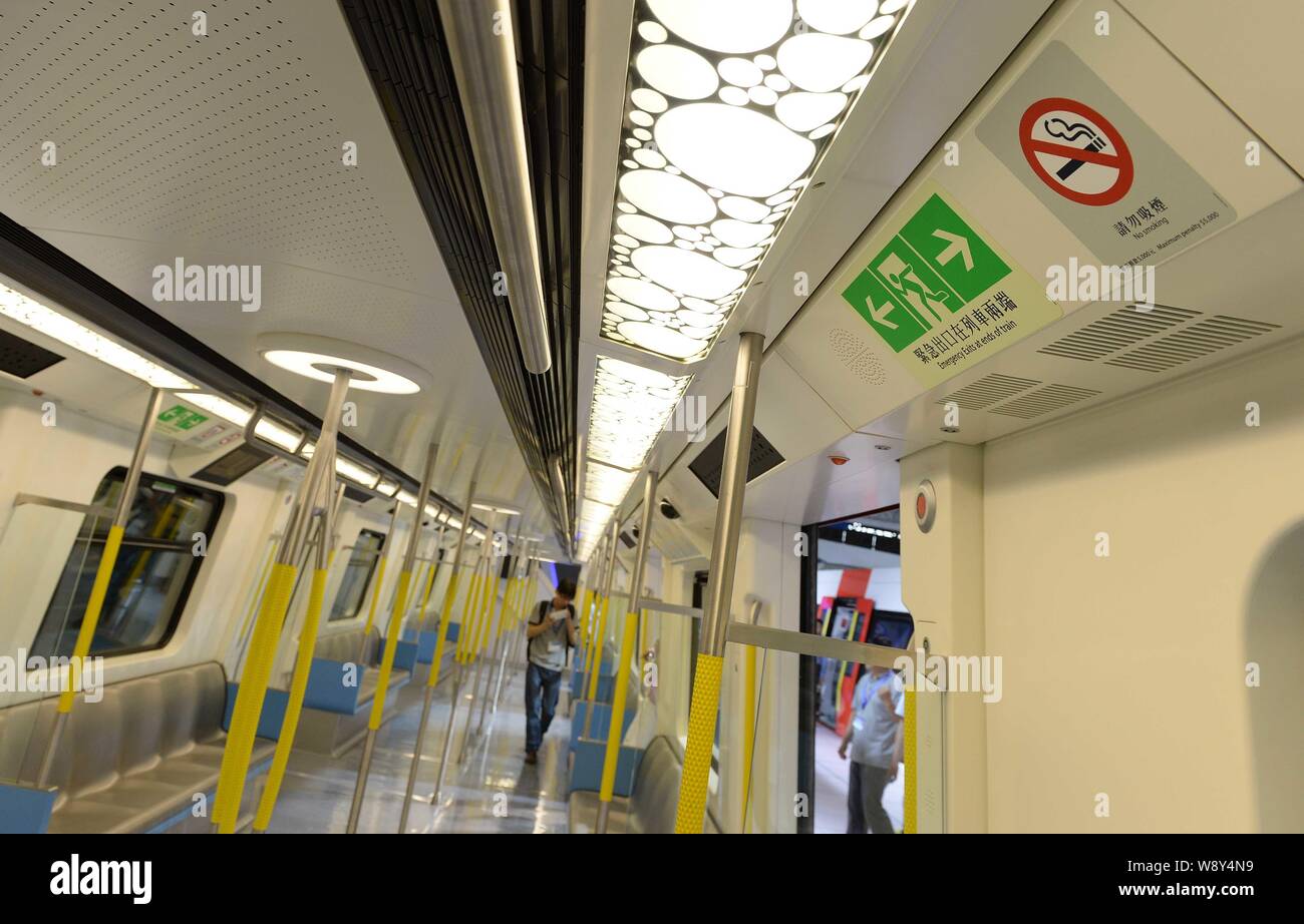 People visit Chinas first driverless subway train during the Rail ...