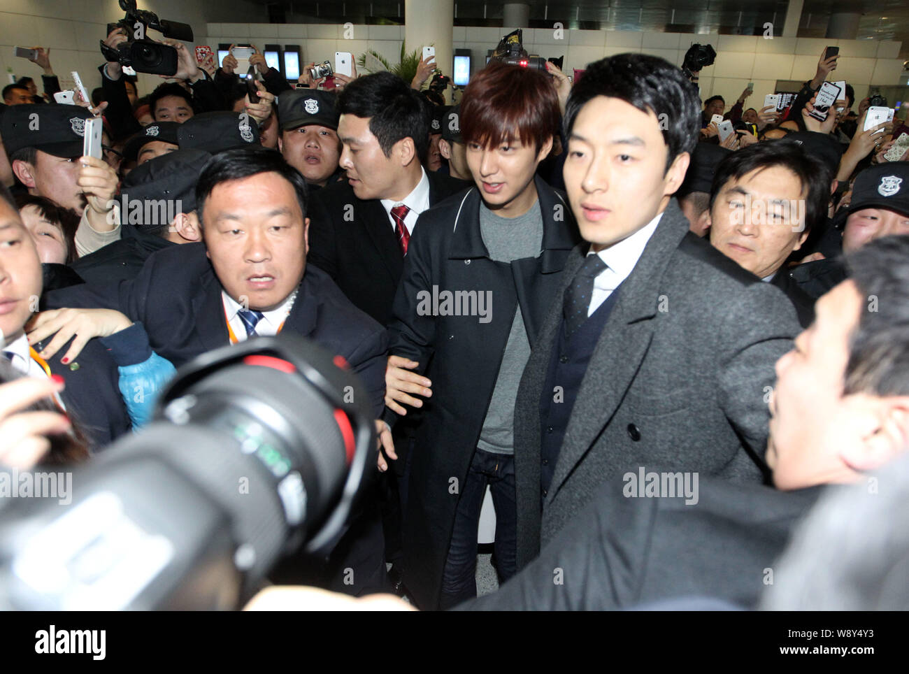 South Korean actor Lee Min-ho, center, is surrounded by crowds of fans ...