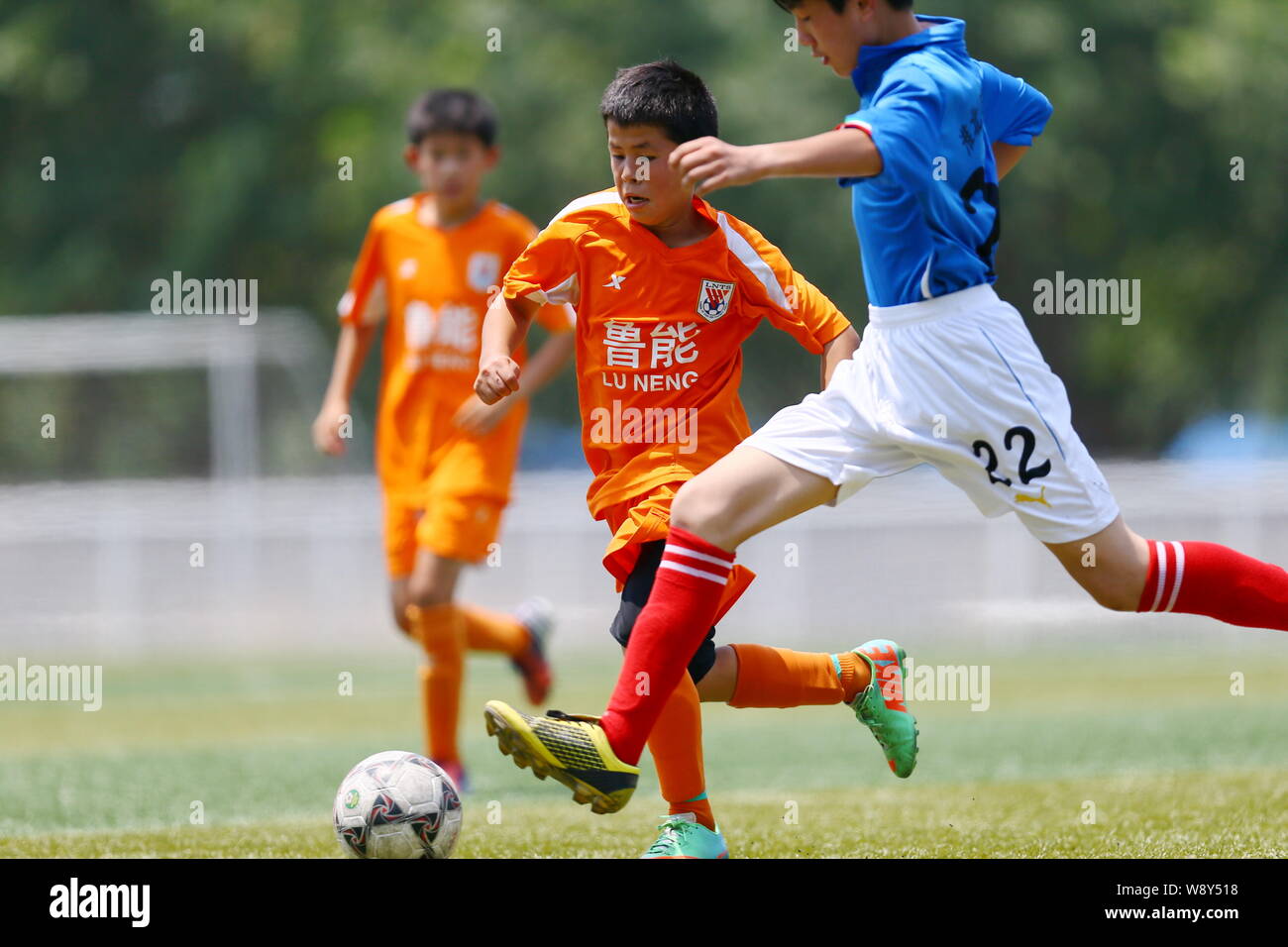 --FILE--Young Chinese boys compete in their match during a children ...