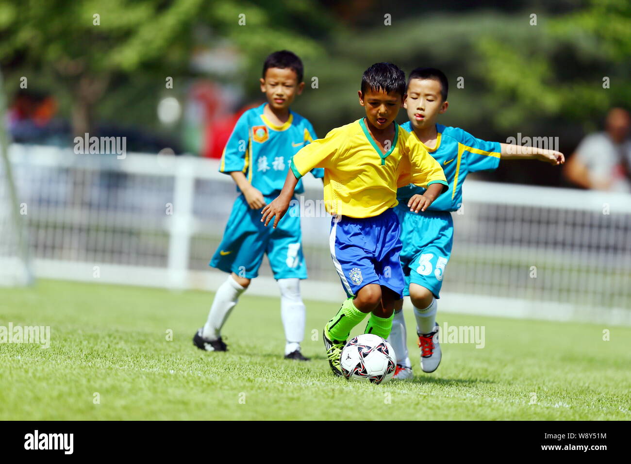 --FILE--Young Chinese boys compete in their match during a children ...