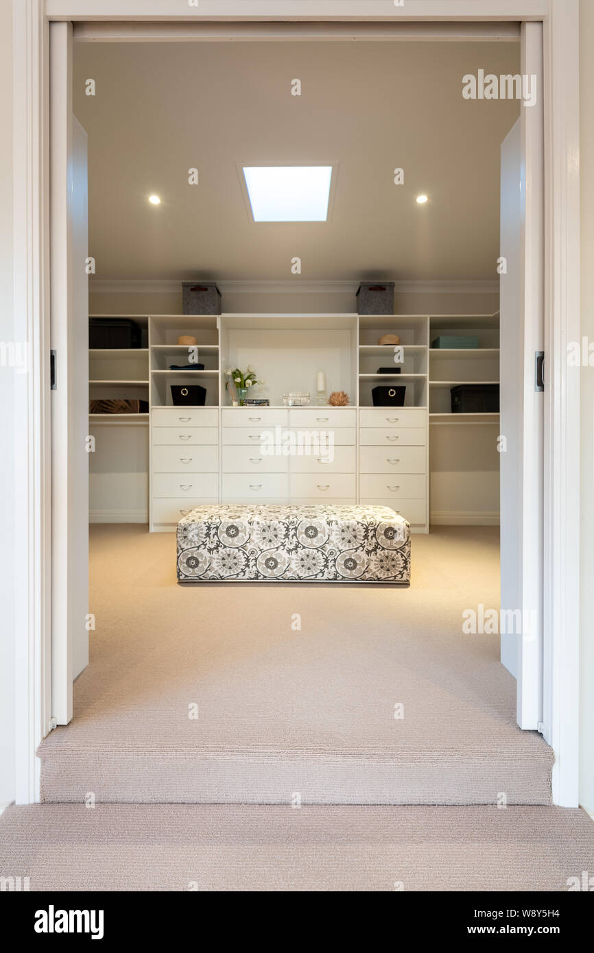 Luxury walk in wardrobe or dressing room in a domestic home or house ...
