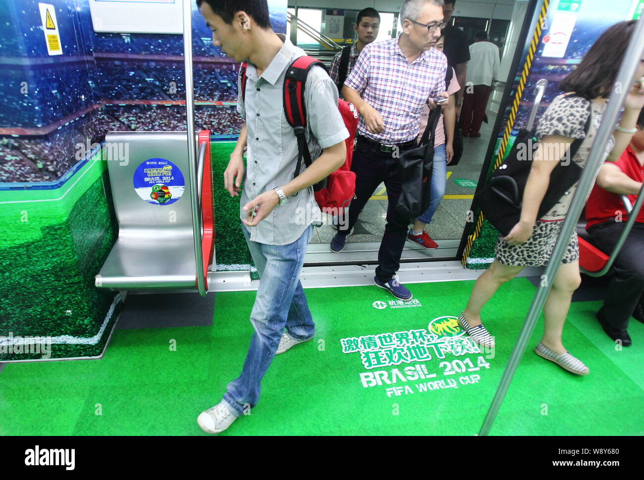 Passengers walk into the special train of Hangzhou Metro Line 1 for the ...