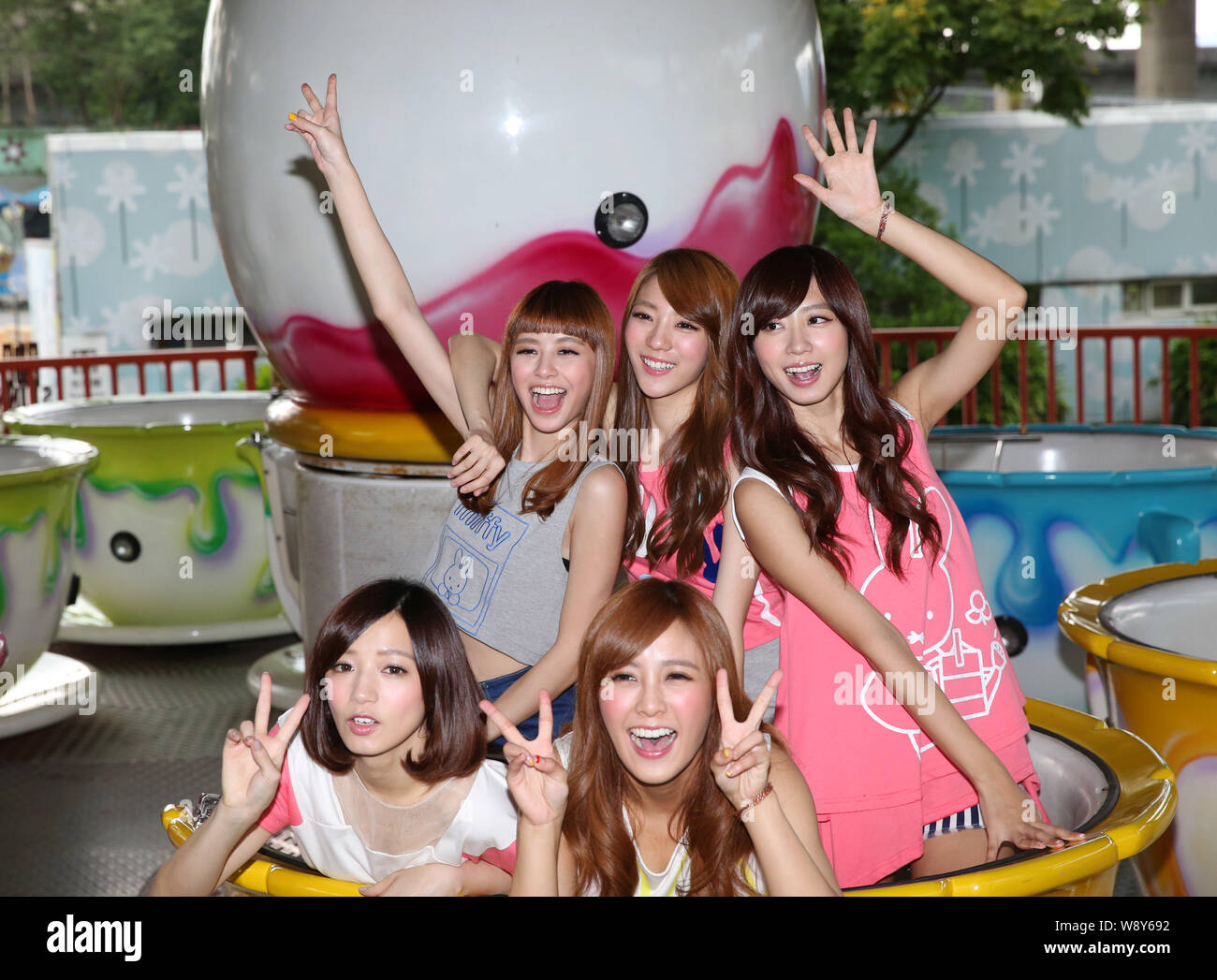 Members of Taiwanese girl group Popu Lady celebrate during an event to ...