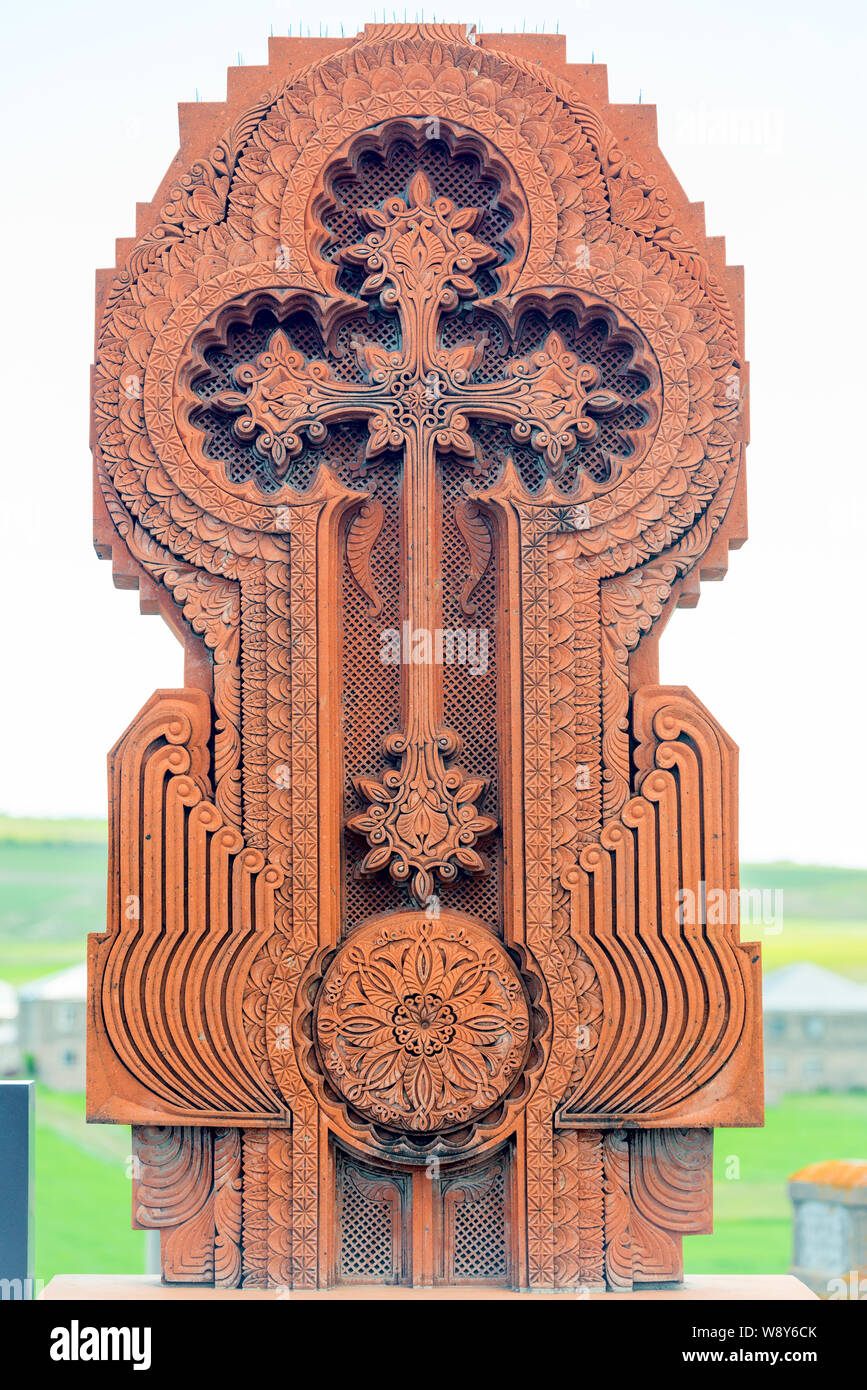 Cross stone Armenian traditional khachkar on a graveyard tombstone ...