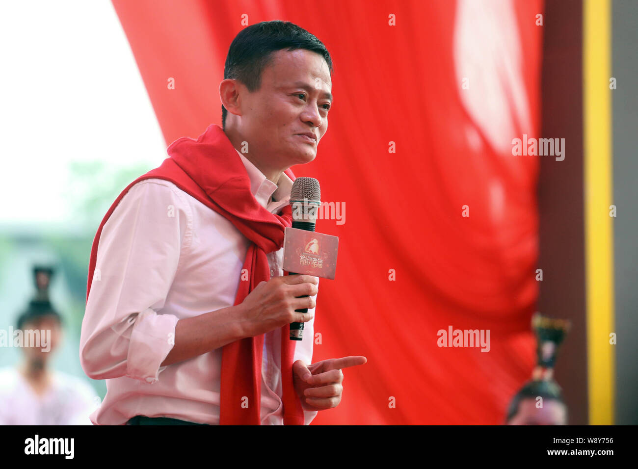 Jack Ma Yun, Chairman of Alibaba Group, speaks during a group wedding ...