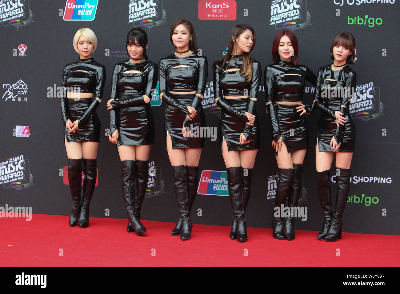 Members of South Korean girl group AOA pose on the red carpet as they arrive for the 2014 Mnet ...