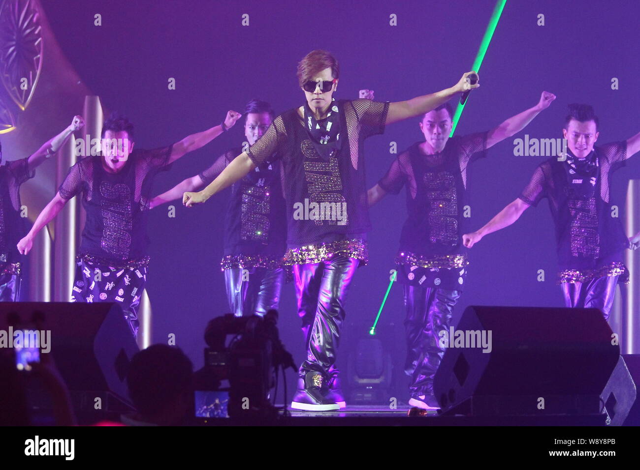 Taiwanese singer Show Lo, center, performs at the concert of his "Show ...