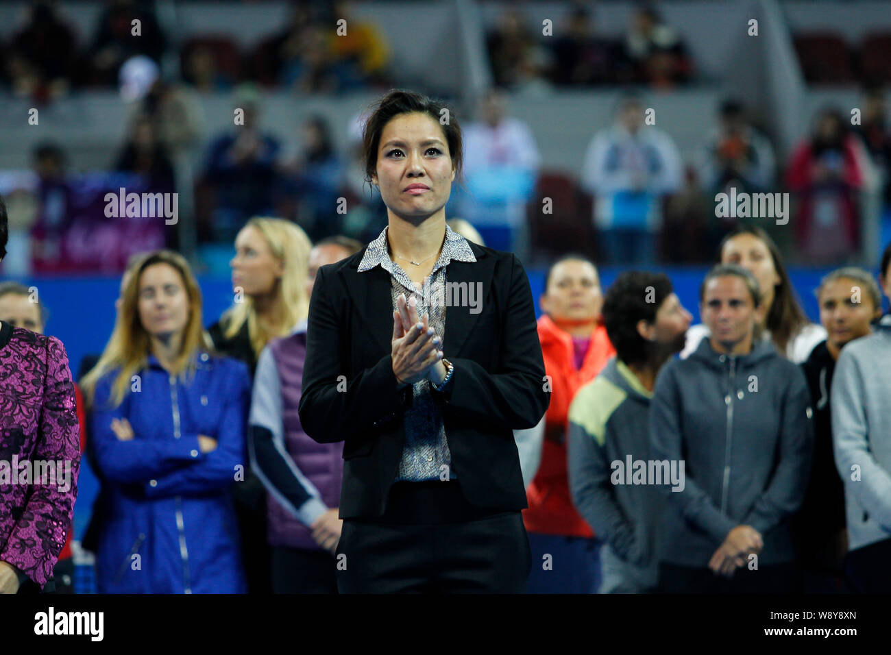 Chinese tennis player Li Na applauds during her retirement ceremony at ...