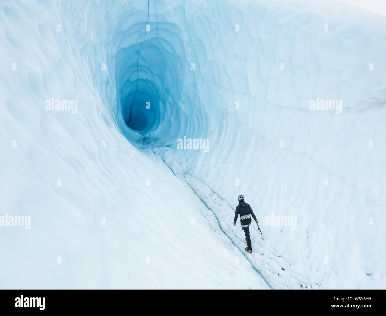 Ice cave on the Matanuska Glacier. Ice caves in Alaska. Deep blue cave ...