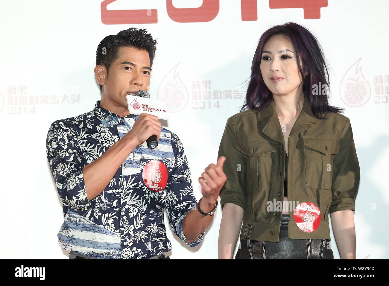 Hong Kong singer and actor Aaron Kwok Fu-shing, left, speaks next to ...