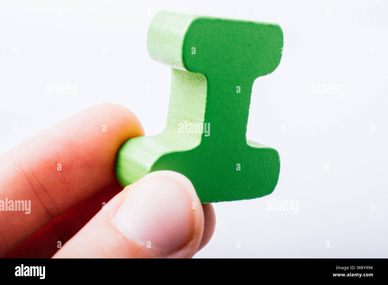 Hand holding Letter cube of I of Alphabet Stock Photo - Alamy