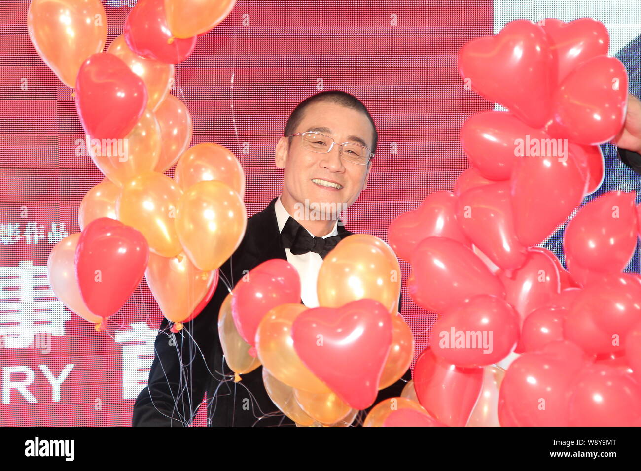 Hong Kong actor Tony Leung Ka-fai poses at the premiere of the movie, Beijing Love Story, in ...