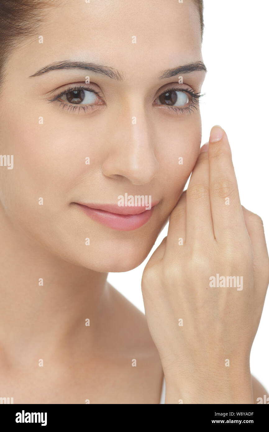 Portrait of a beautiful young woman touching soft skin Stock Photo - Alamy