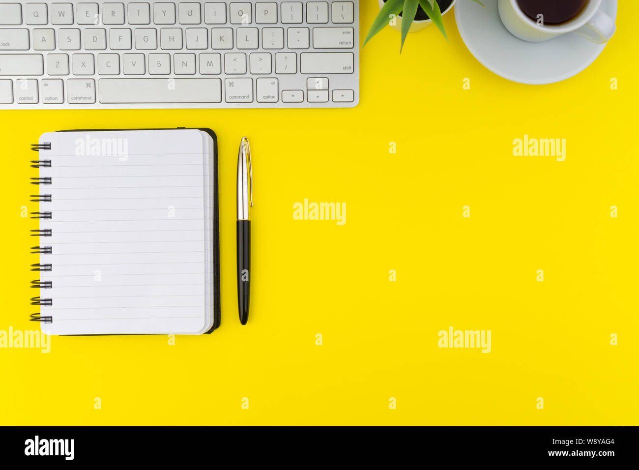 Flat lay view of office table desk. Workspace with keyboard, pen, book ...