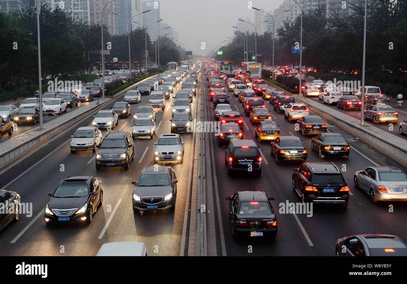 Night view of highways and roads overcrowded by masses of vehicles ...