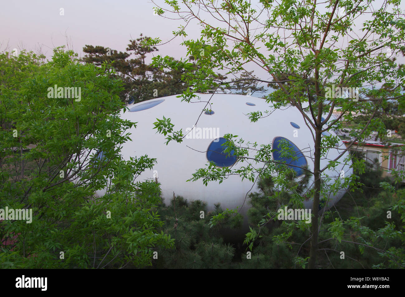 A UFO-shaped building is pictured at a scenic spot near a beach in ...