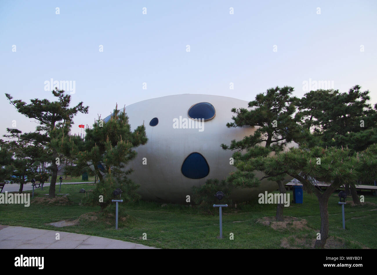 A UFO-shaped building is pictured at a scenic spot near a beach in ...
