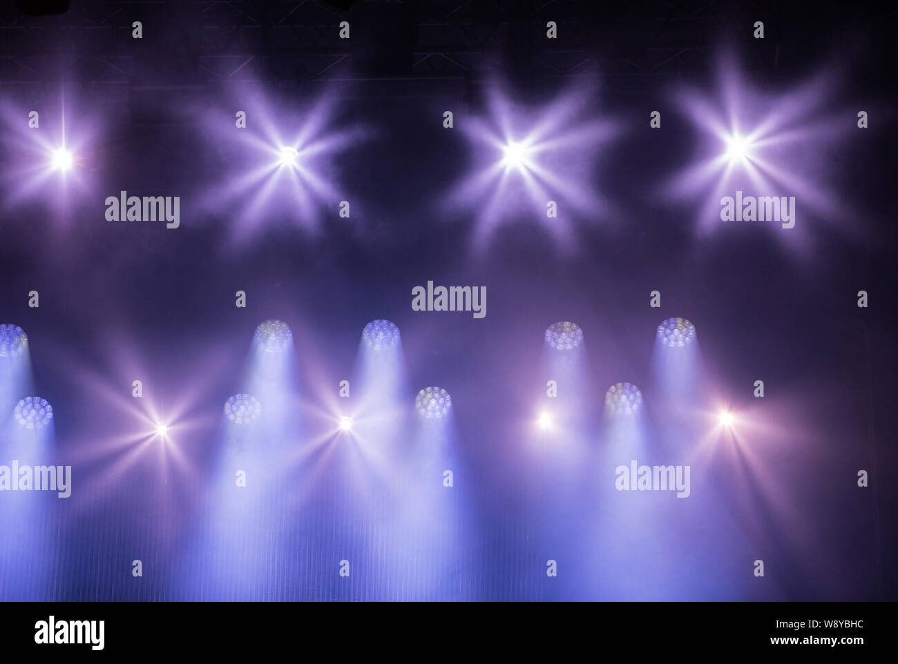 Purple stage lights at music festival Stock Photo - Alamy