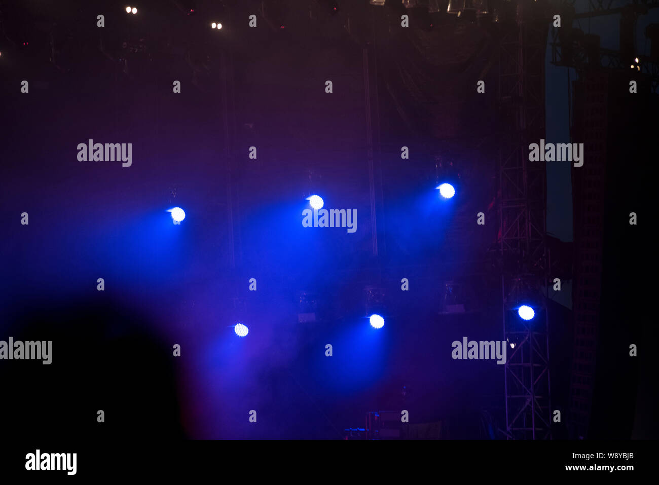 Blue stage lights at music festival Stock Photo - Alamy