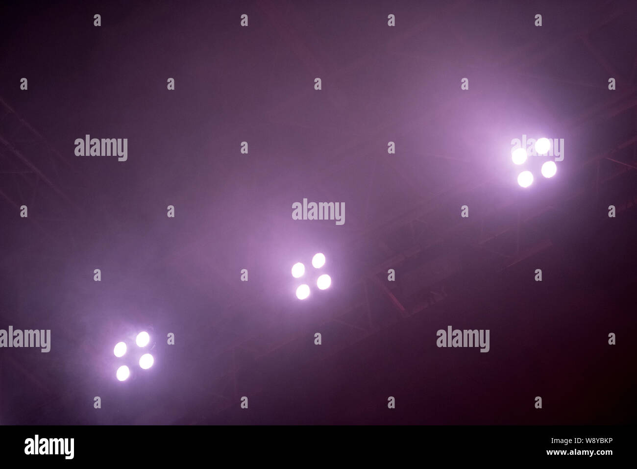 Purple stage lights at music festival Stock Photo - Alamy