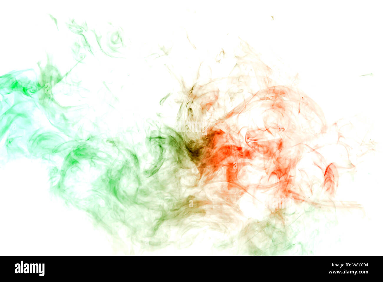 Abstract wavy ink and smoke pattern in green and red on a white ...