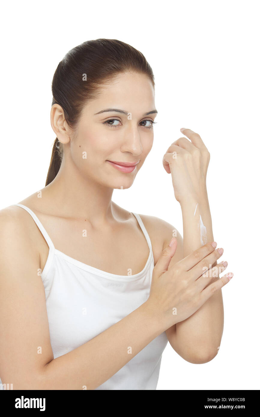 Woman rubbing cream arm hi-res stock photography and images - Alamy
